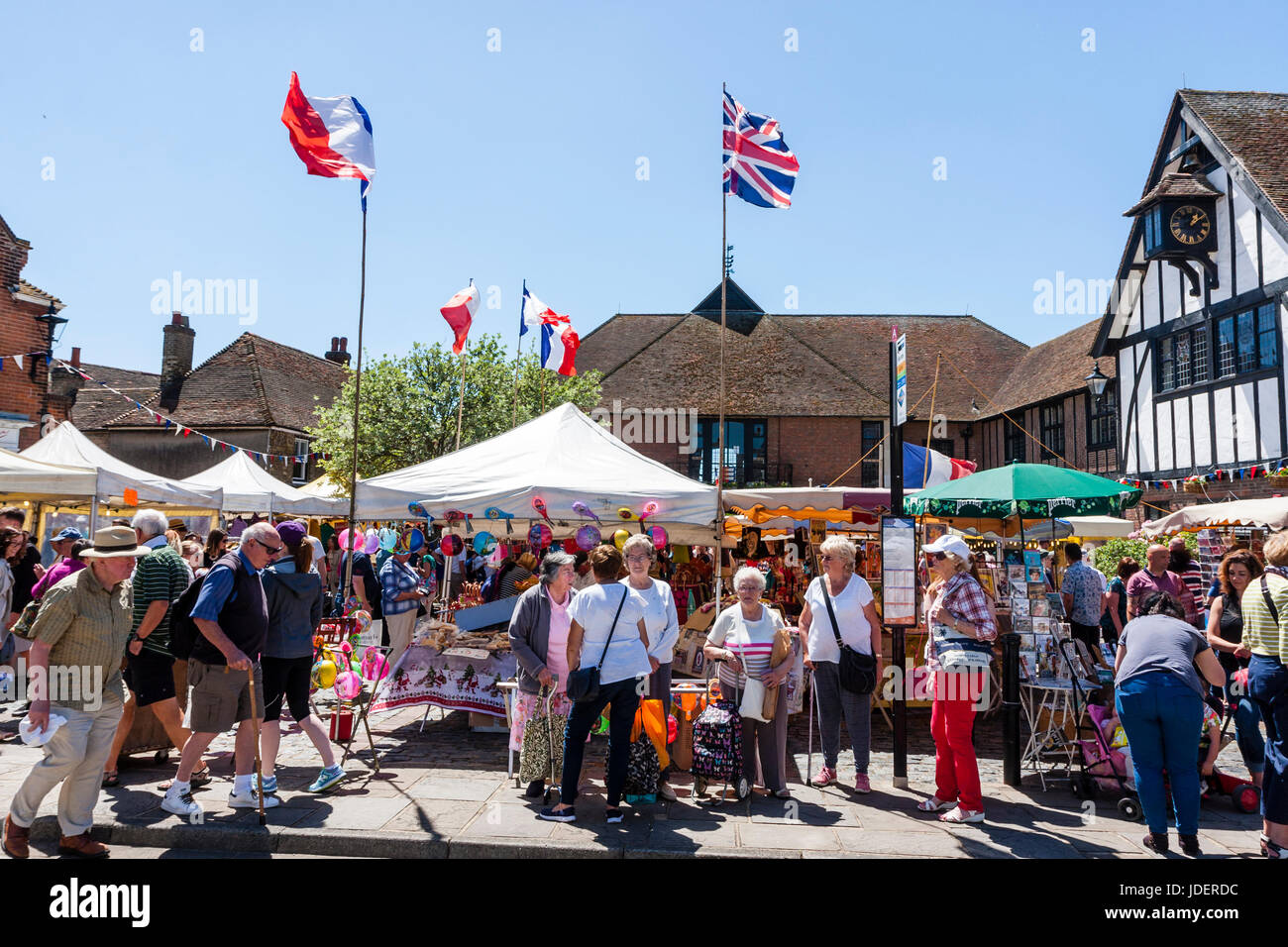 French market event outside 15th century guildhall at English town ...