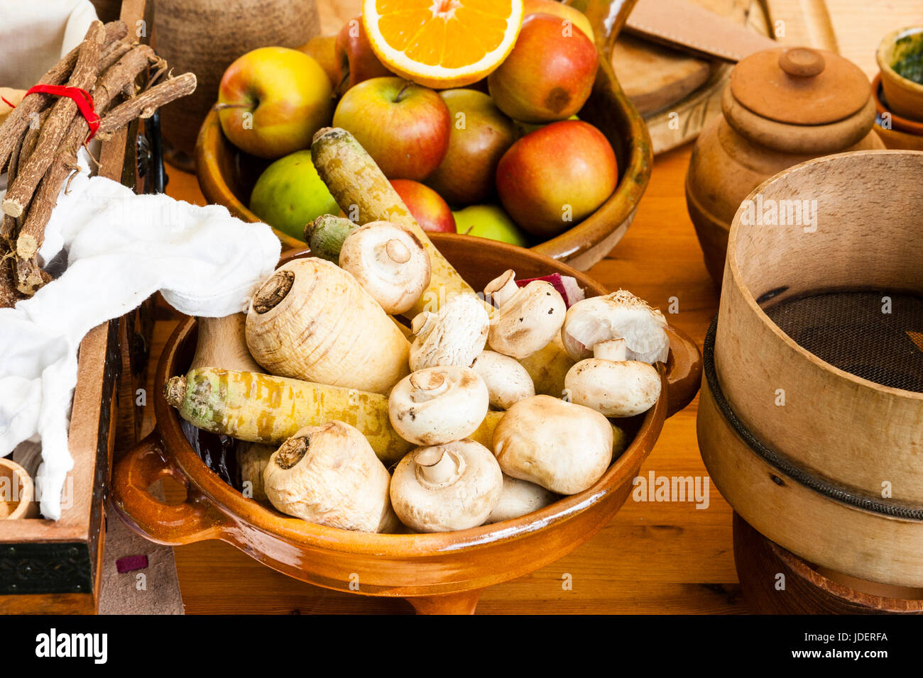 Medieval re-enactment event. Food. Two wooden bowls on table, one ...