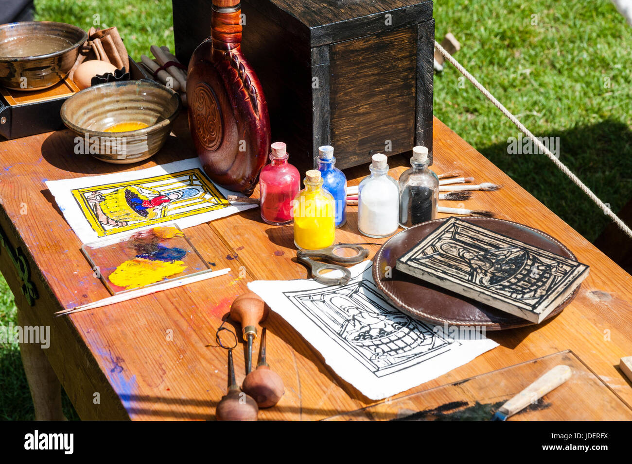 Medieval living history event. Bottles of coloured inks on printer's ...