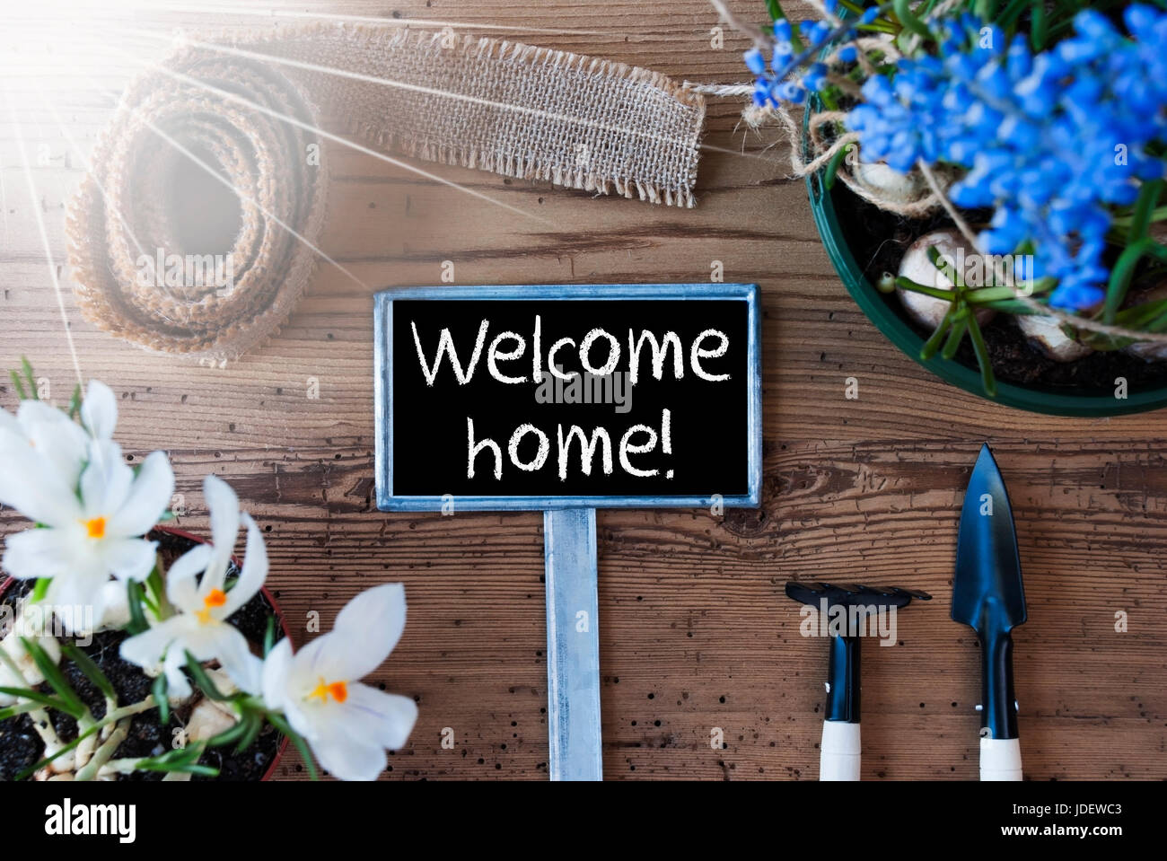 Sunny Spring Flowers, Sign, Text Welcome Home Stock Photo - Alamy