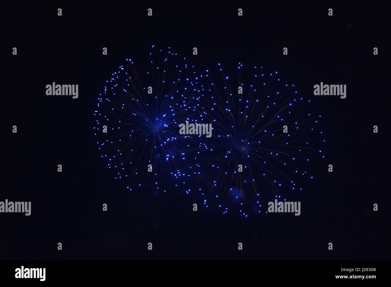 Blue fireworks in sky hi-res stock photography and images - Alamy