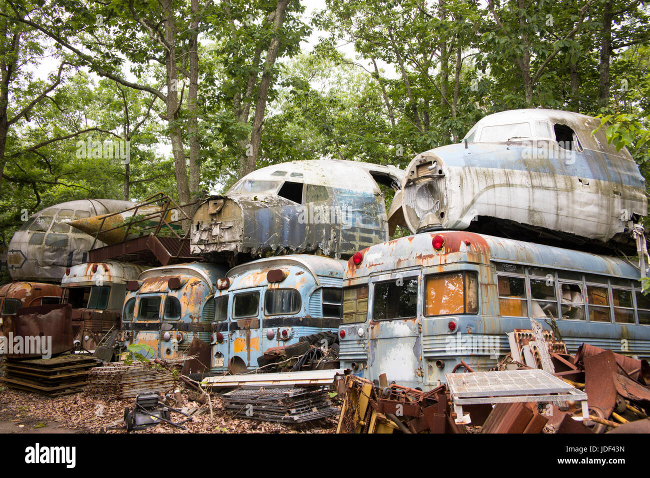 Cockpit units of wrecked military aircraft on top of transport busses ...