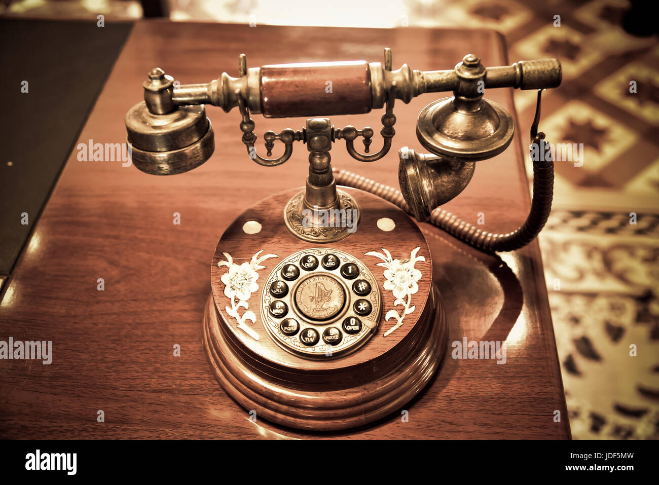 Vintage telephone on old table Stock Photo - Alamy