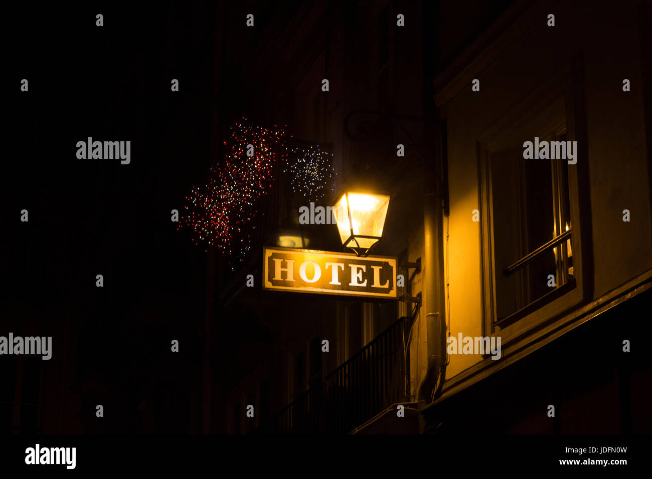 View of a hotel sign, street light and many colorful decoration lights ...
