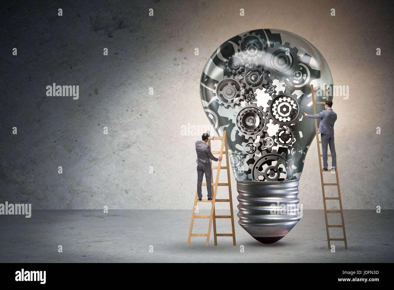 Businessman on ladder repairing light bulb Stock Photo - Alamy