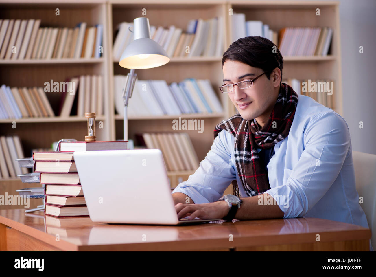 Young writer working in the library Stock Photo - Alamy