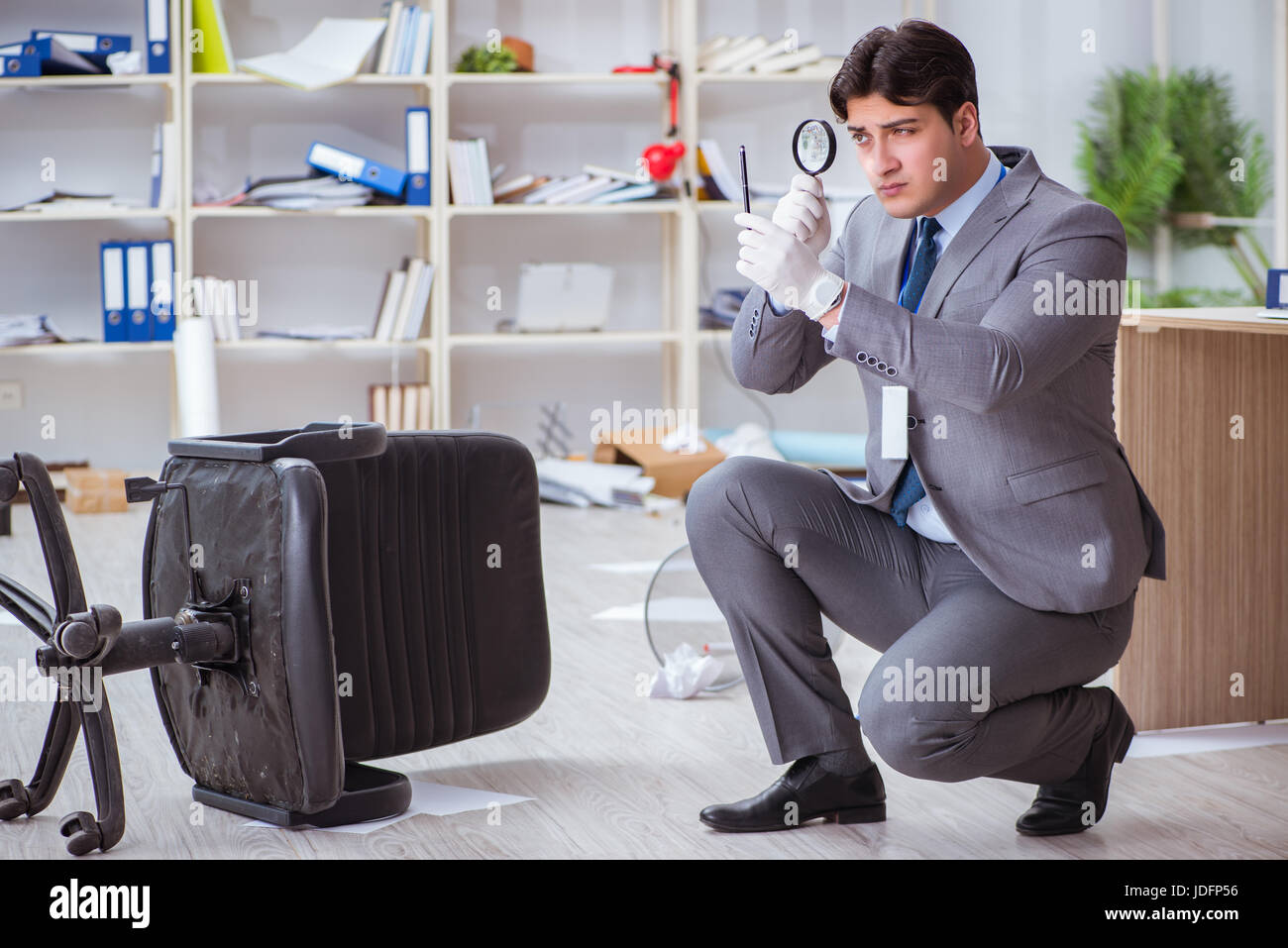 Young man during crime investigation in office Stock Photo - Alamy