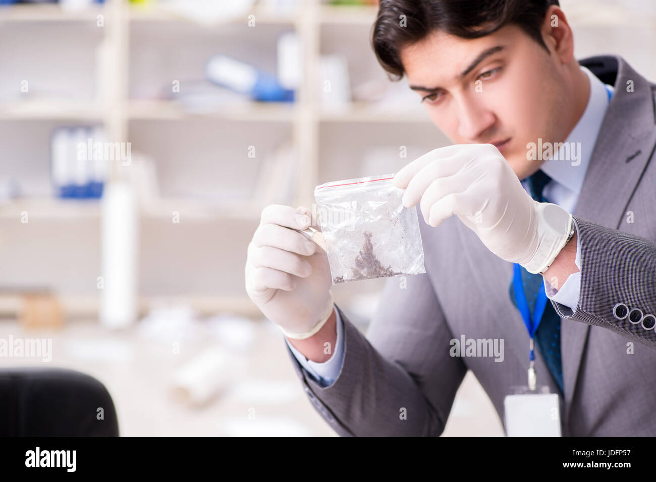 Young man during crime investigation in office Stock Photo - Alamy