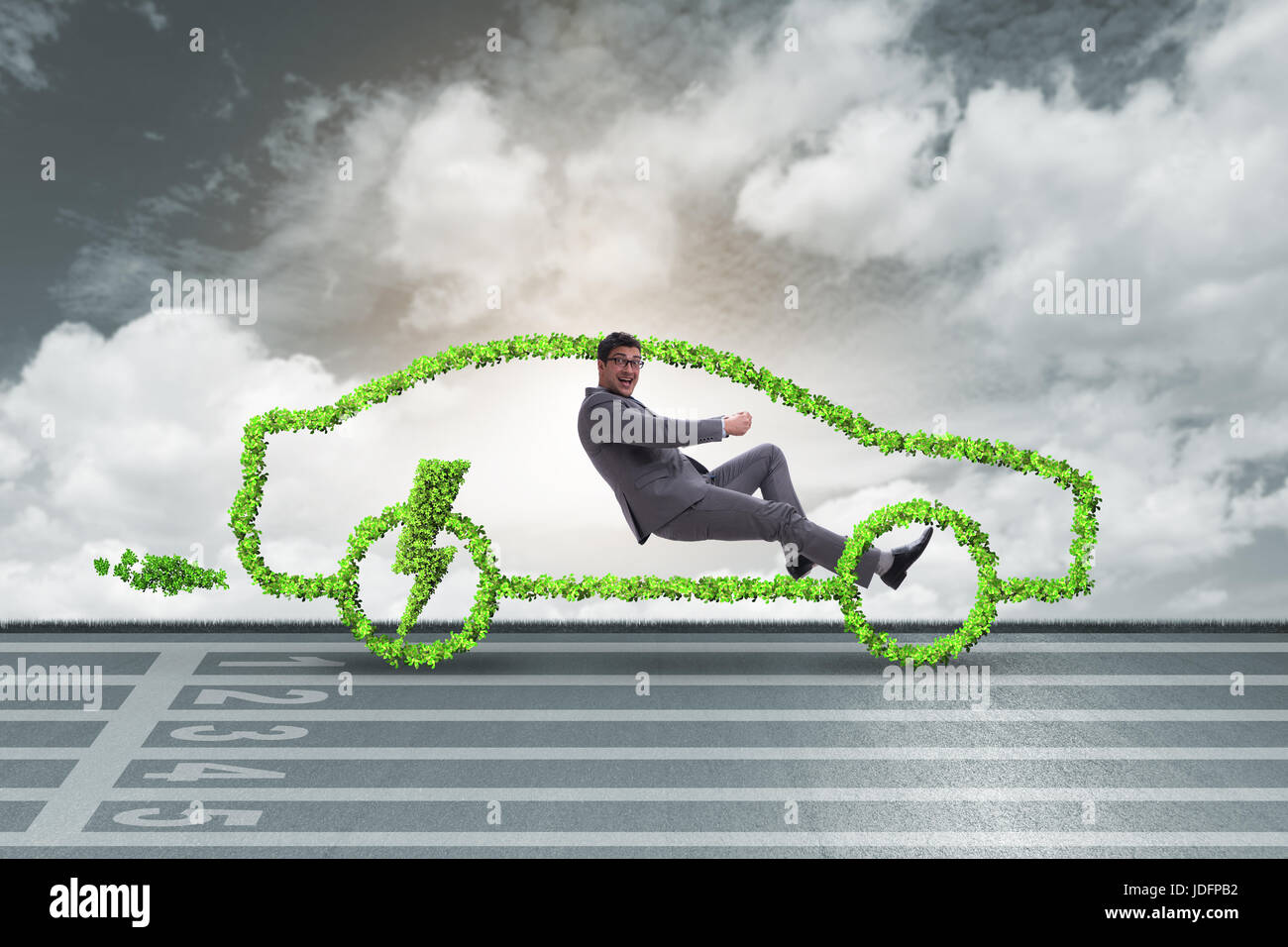 Electric car concept in green environment concept Stock Photo - Alamy