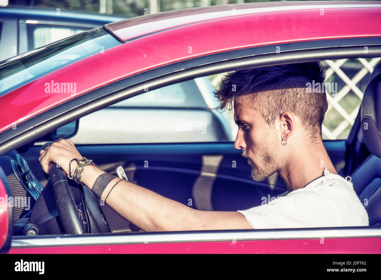Inattentive Handsome Young Man Busy with his Mobile Phone While Driving ...