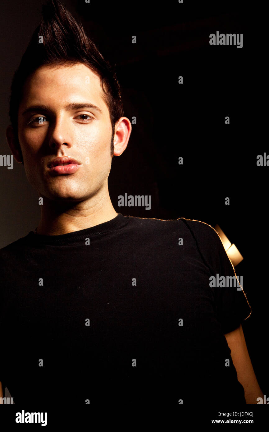 Young punk rocker staring and looking mean Stock Photo - Alamy