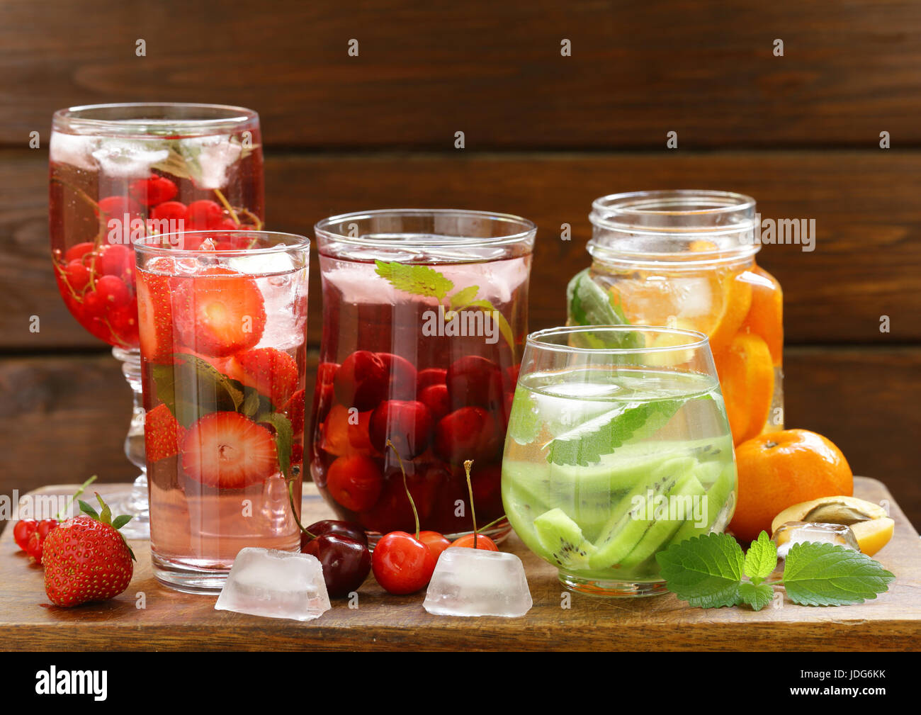 Natural fruit lemonades with ice, summer drink Stock Photo - Alamy