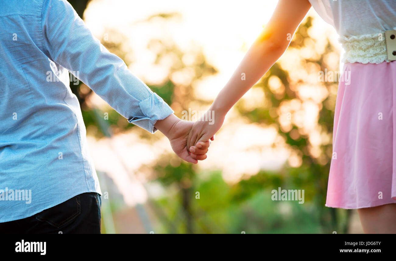 Happy couple, hand in hand.Stroll in the evening Stock Photo - Alamy