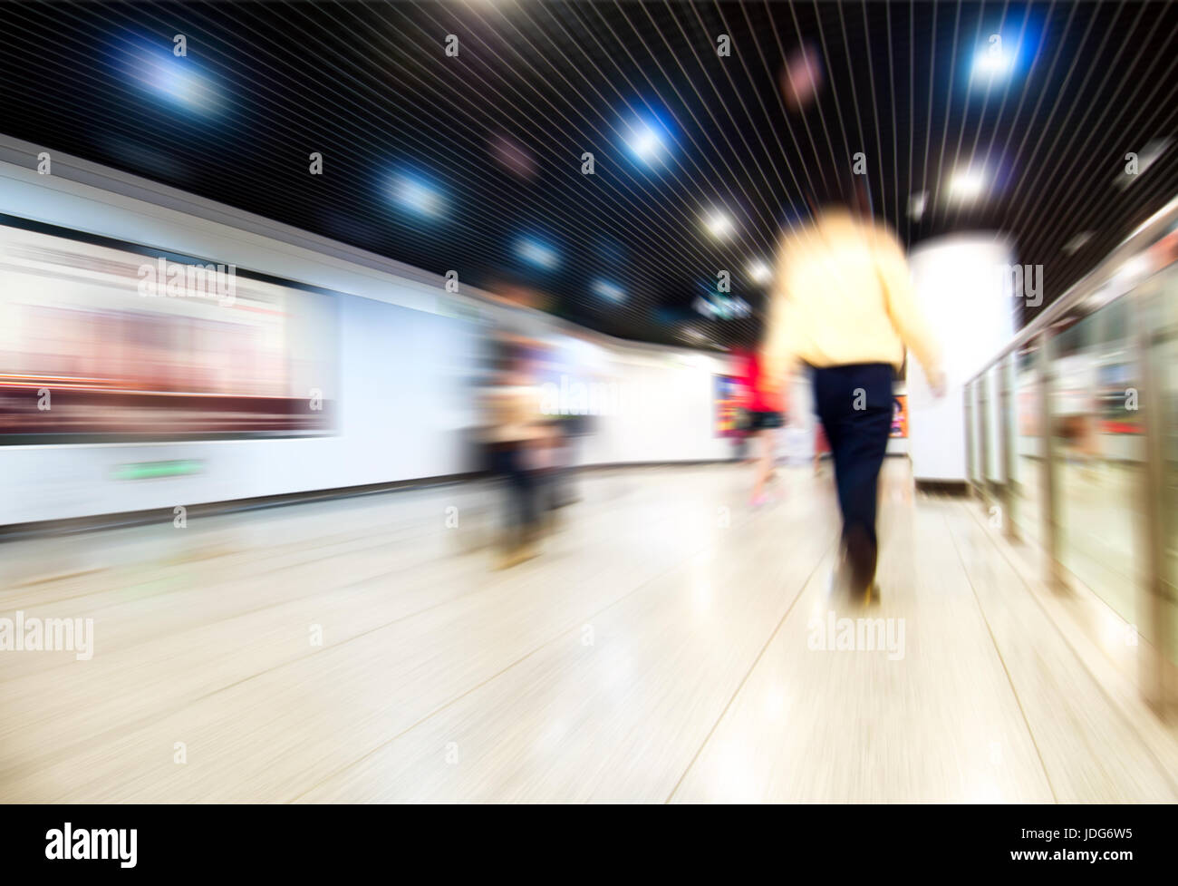 Crowd walking in a corridor Stock Photo - Alamy