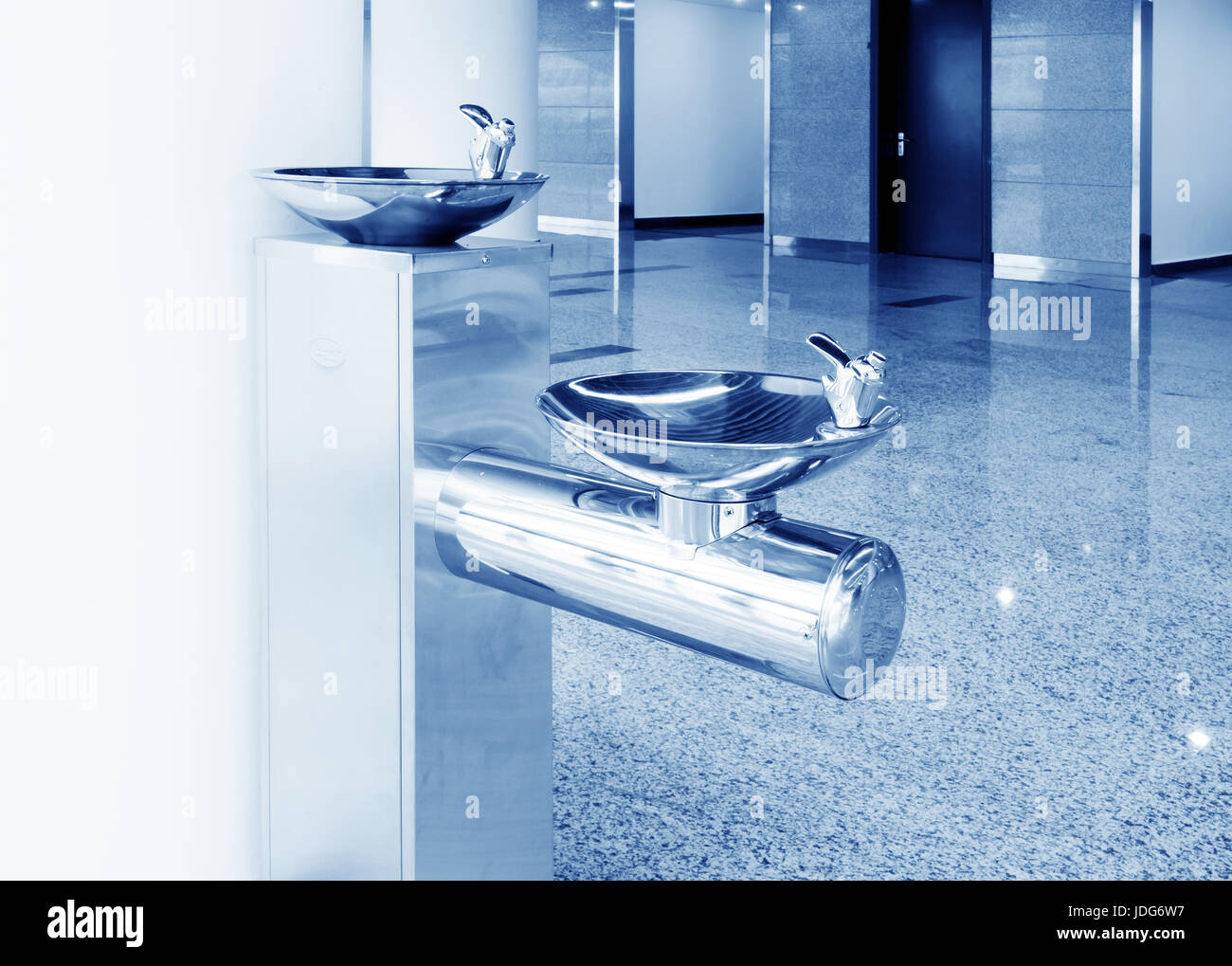 Hall drinking fountains, modern building interior Stock Photo - Alamy