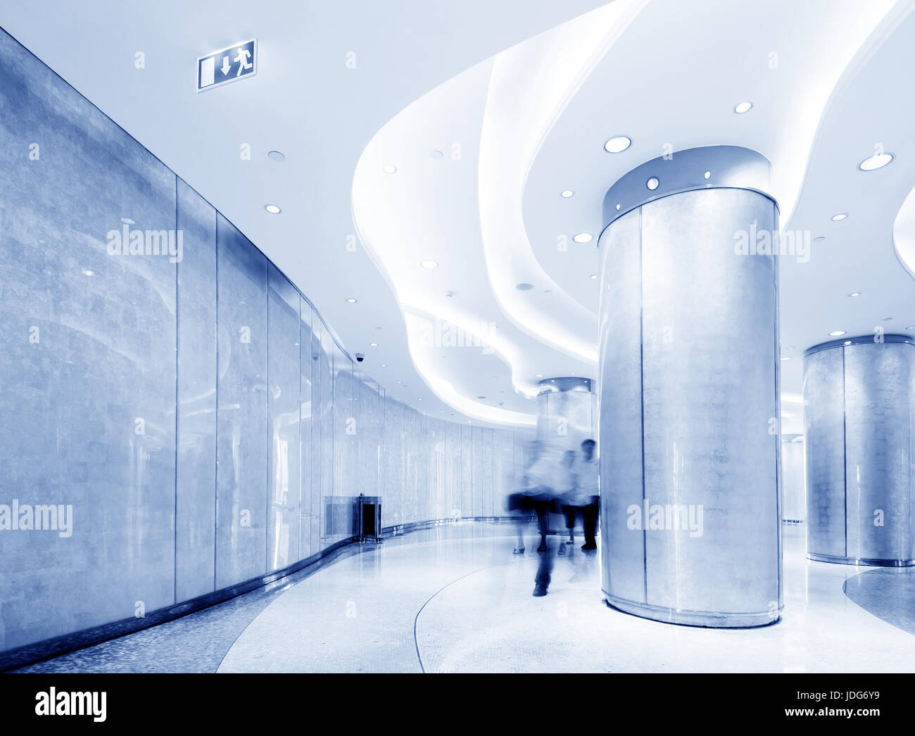 Crowd walking in a corridor Stock Photo - Alamy