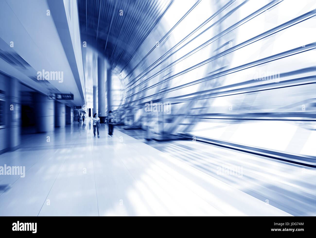 Crowd walking in a corridor Stock Photo - Alamy