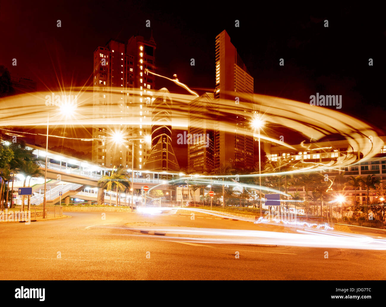 Highway light trails, modern city at night Stock Photo - Alamy