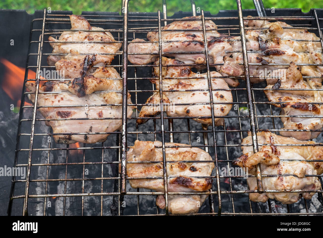 Chicken grilled on a coals Stock Photo - Alamy
