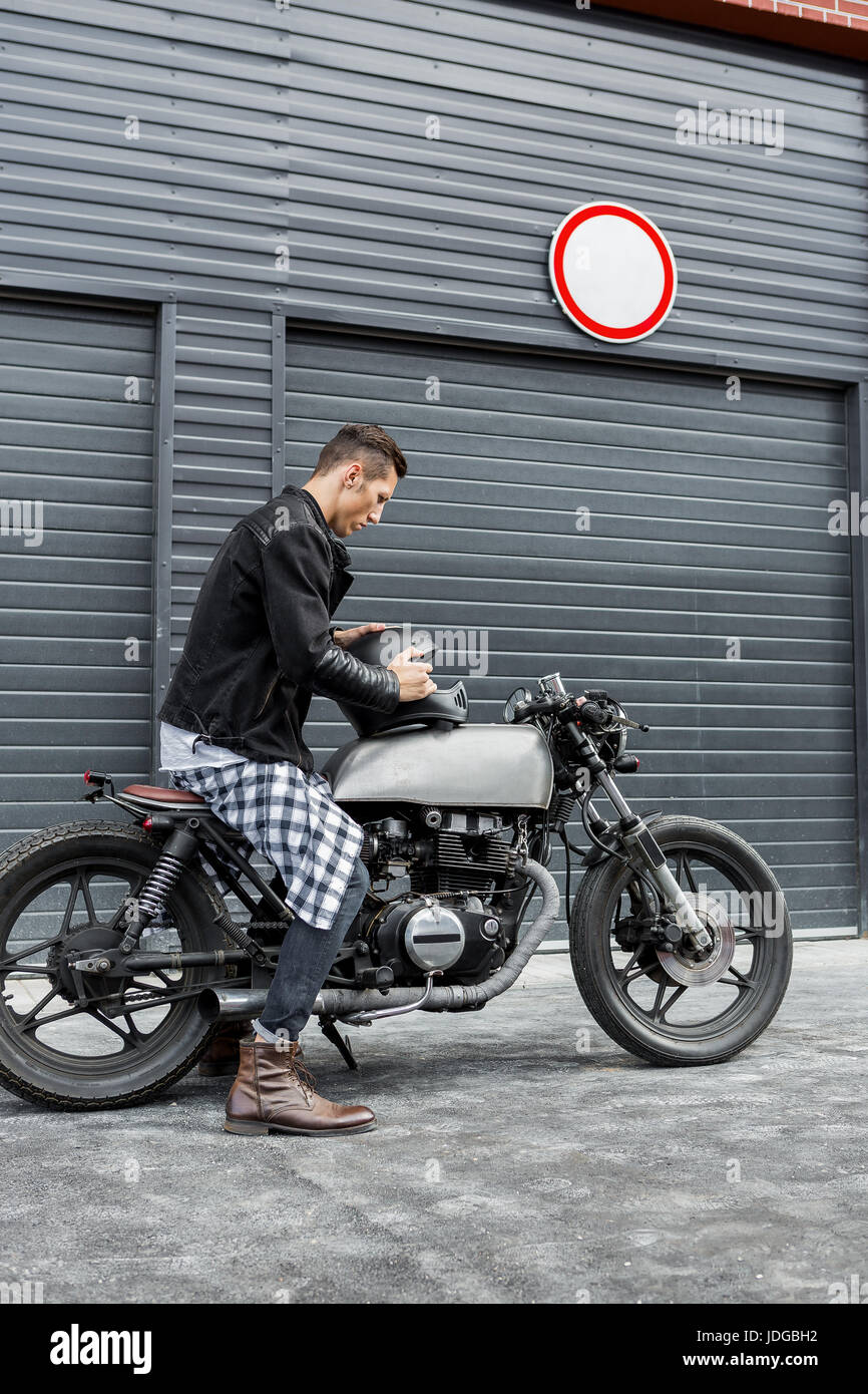 Handsome rider man biker in black leather jacket get off classic style ...