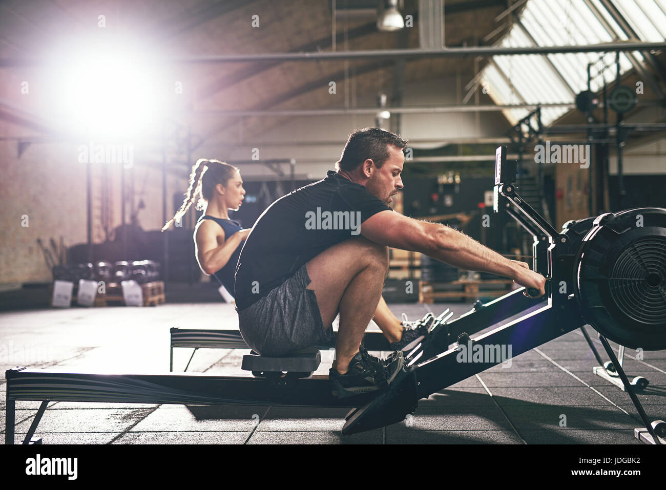 Man and woman muscles working out hi-res stock photography and images ...