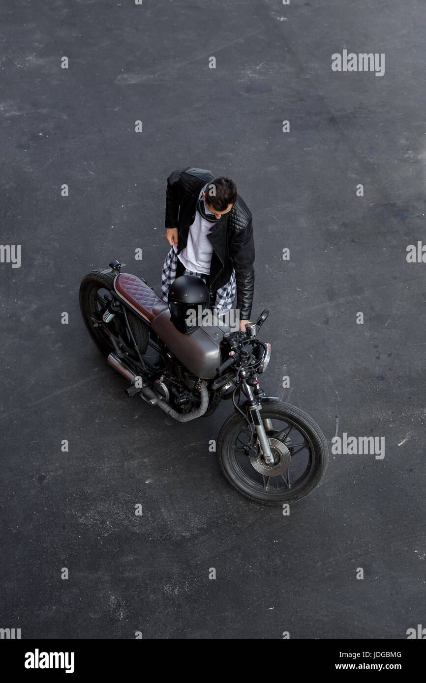 Top view of a handsome rider man in black leather biker jacket and ...