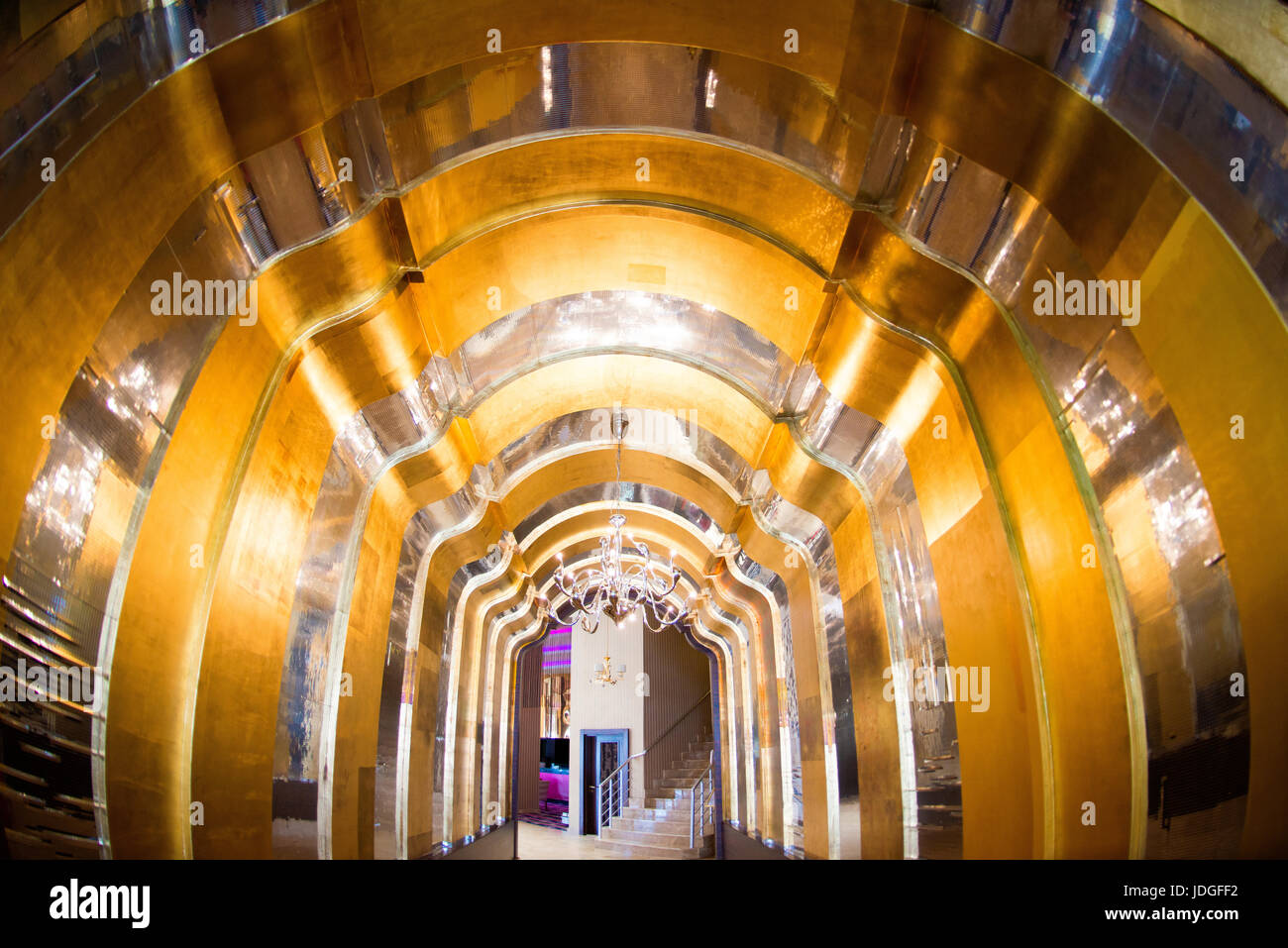 Corridor of arches diminishing to vanishing point at infinity abstract ...