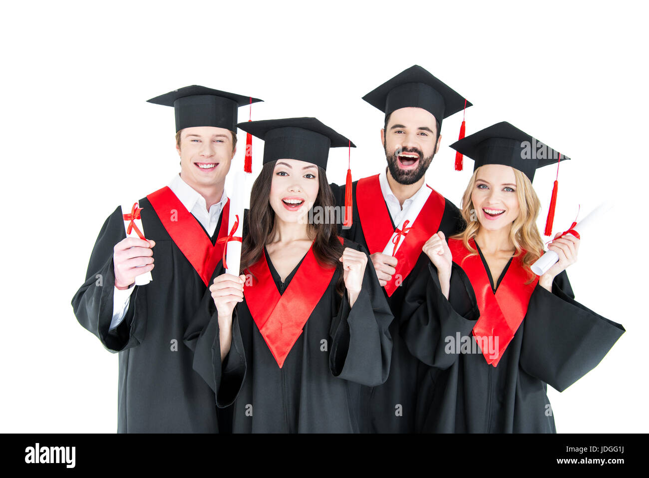 Happy young students in academic caps holding diplomas and smiling at ...