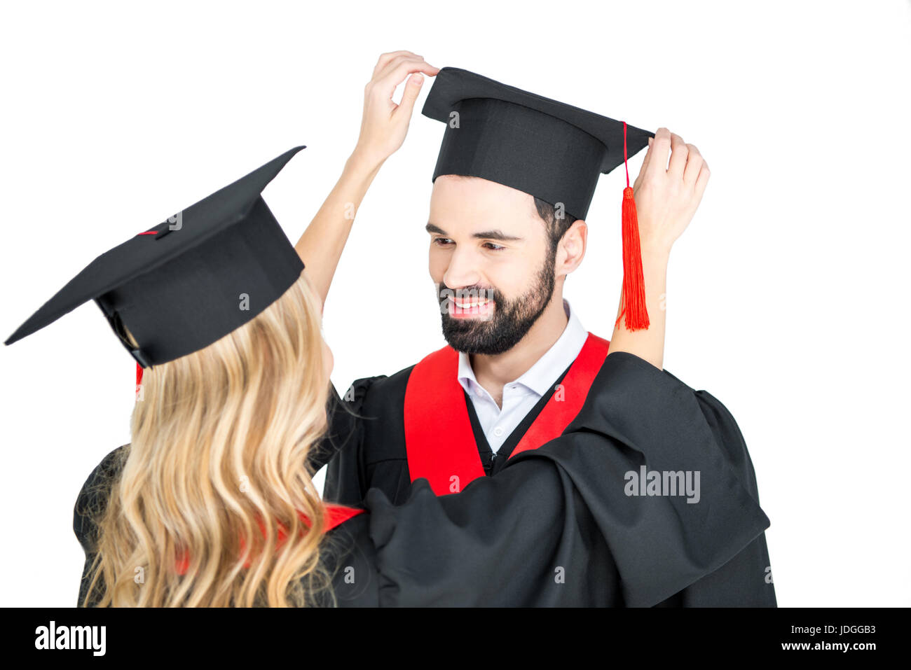 girl fixing student's graduation cap isolated on white Stock Photo - Alamy