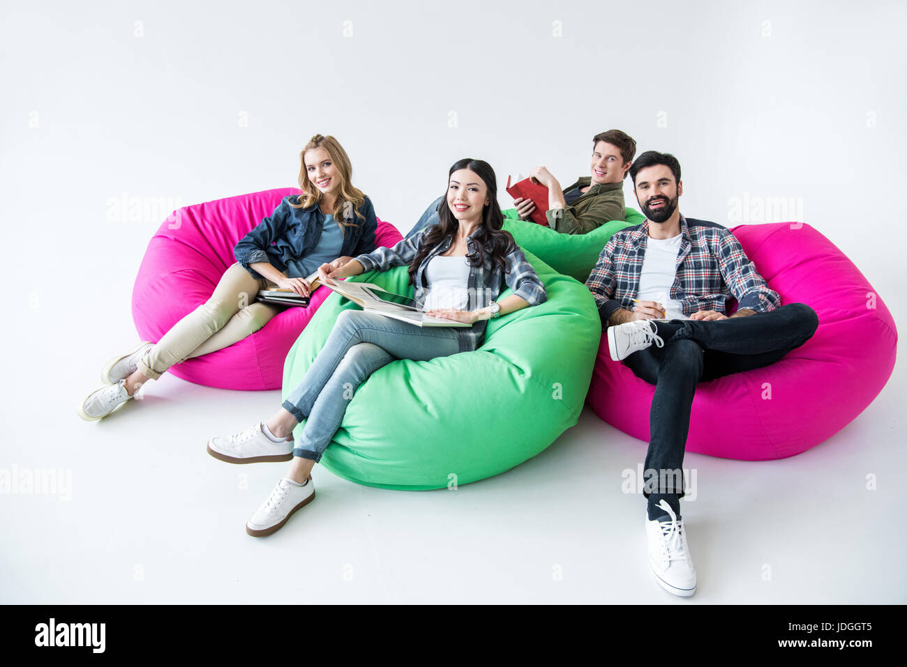 Sitting on bean bags hi-res stock photography and images - Alamy