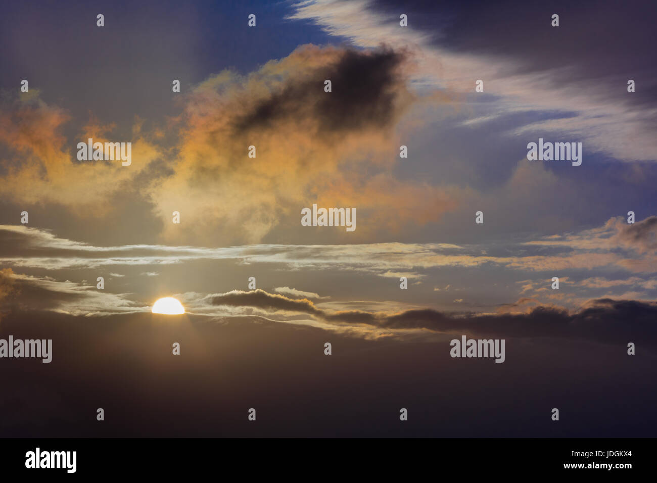 a beautiful sunrise over the rain clouds Stock Photo - Alamy