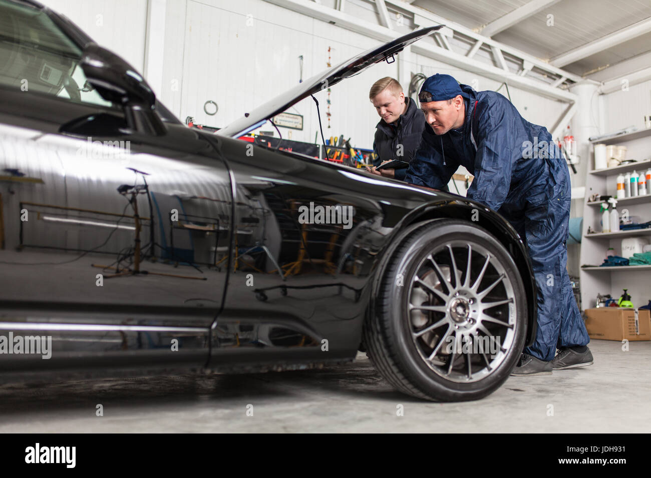 Sports car in a workshop Stock Photo - Alamy