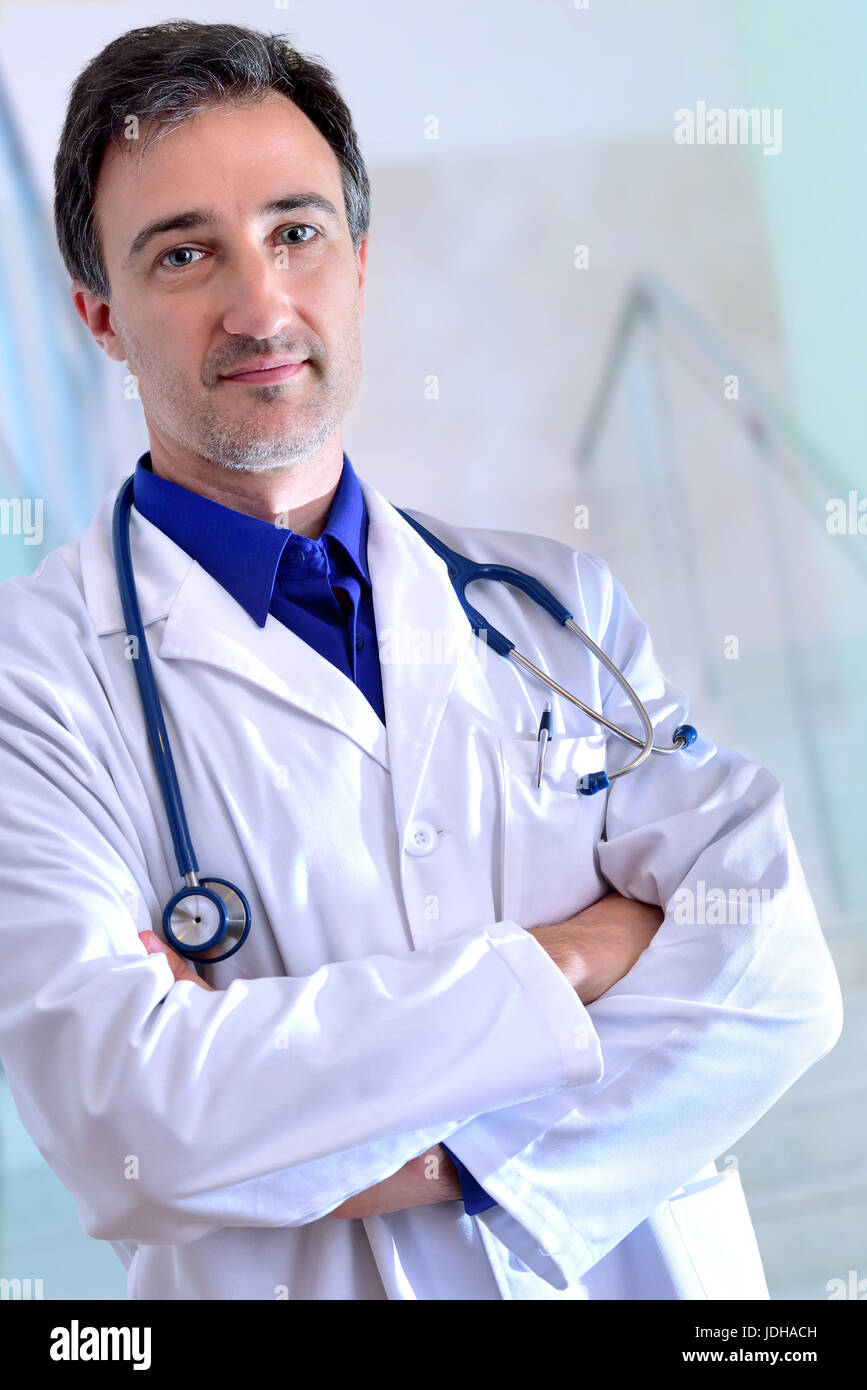 Caucasian general doctor with crossed arms with stairs background ...