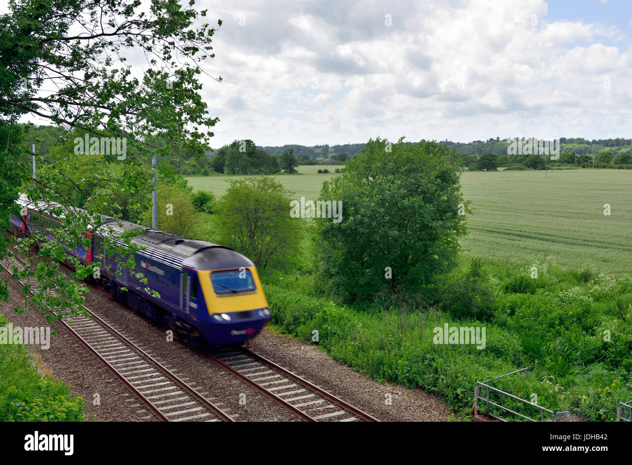 Train speeding through Berkshire countryside Stock Photo - Alamy