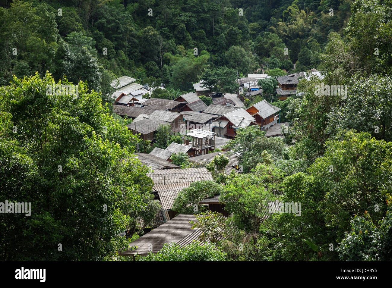 Scenery of rural village inside green area of tropical forest in ...