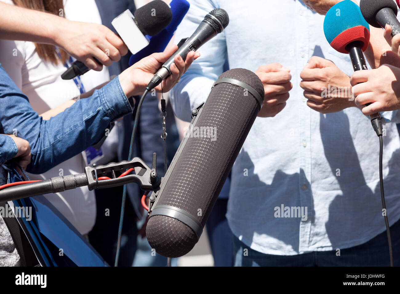 Journalists or reporters making media interview with unrecognizable ...