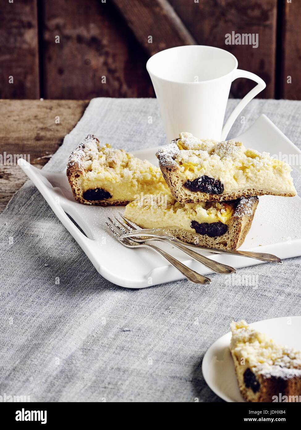 Pudding crumble cake with prunes Stock Photo - Alamy