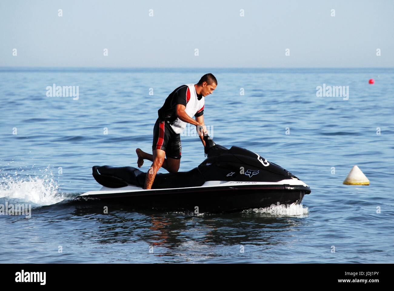 Man riding a jet ski hi-res stock photography and images - Alamy