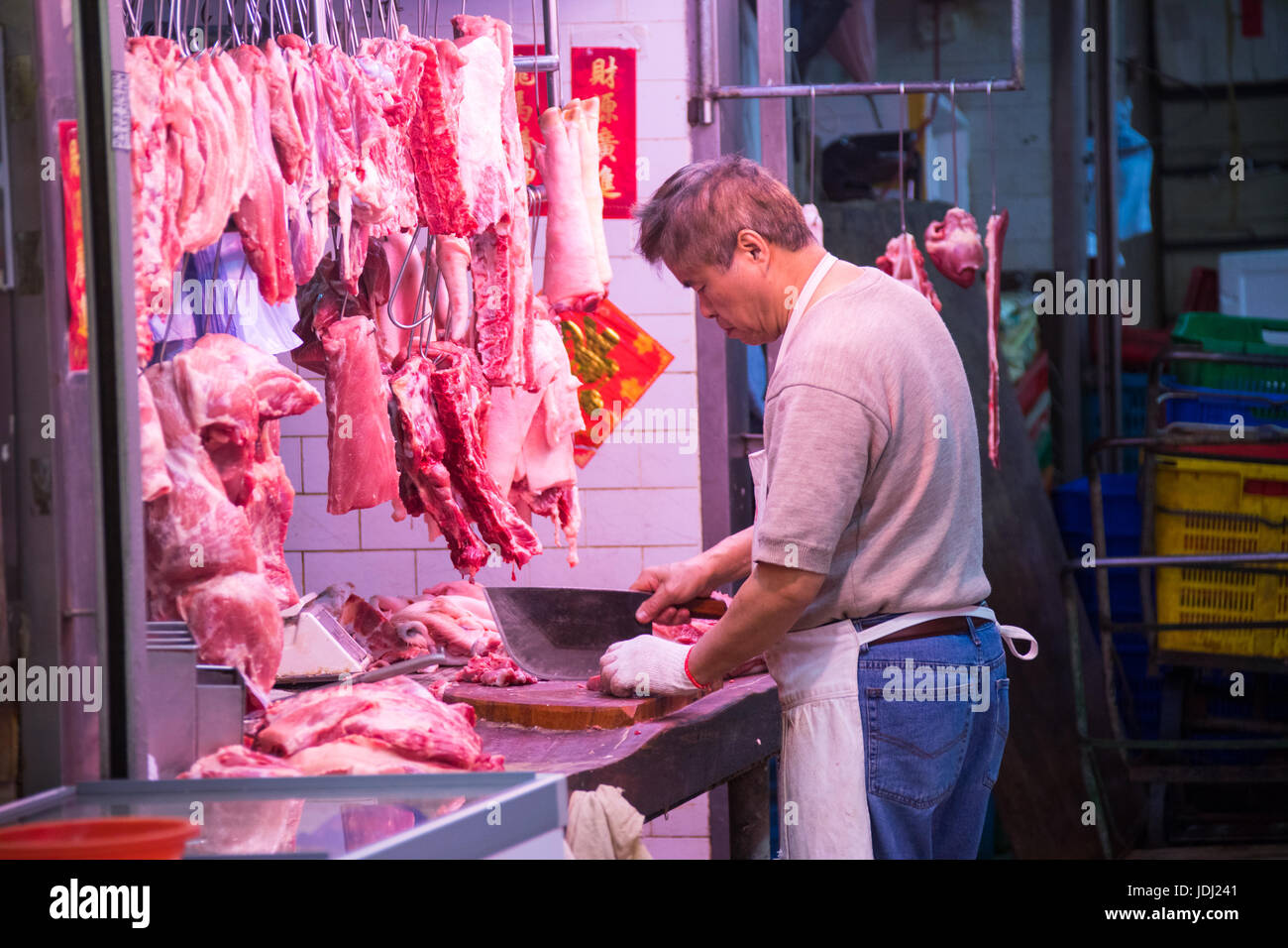 Man chopping meat at meat market hi-res stock photography and images ...