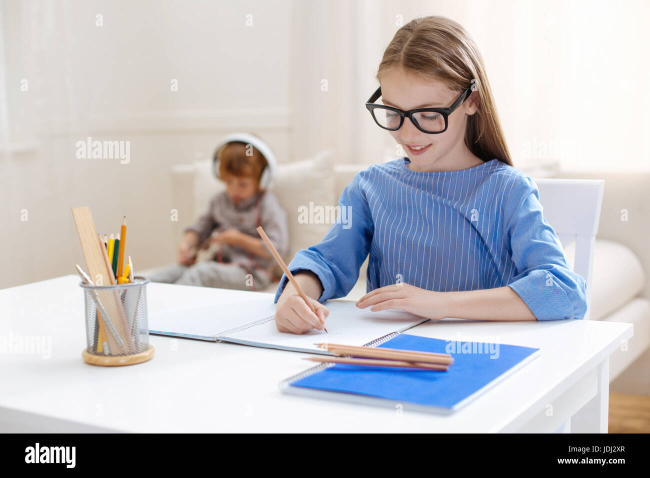 Cute motivated girl being a diligent student Stock Photo - Alamy