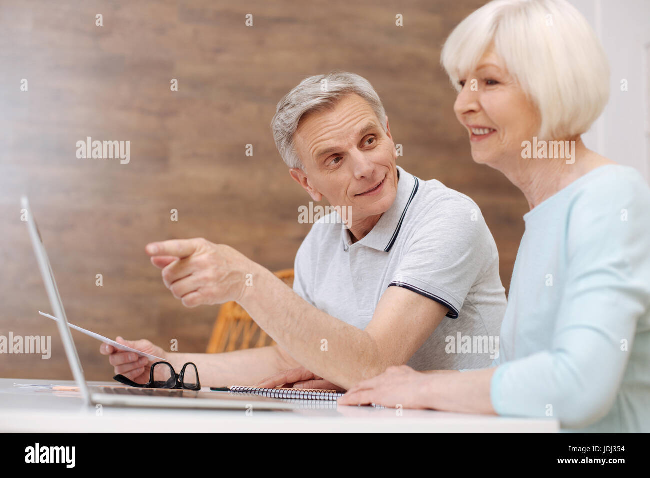 Interested clever man asking questions about wifes project Stock Photo ...