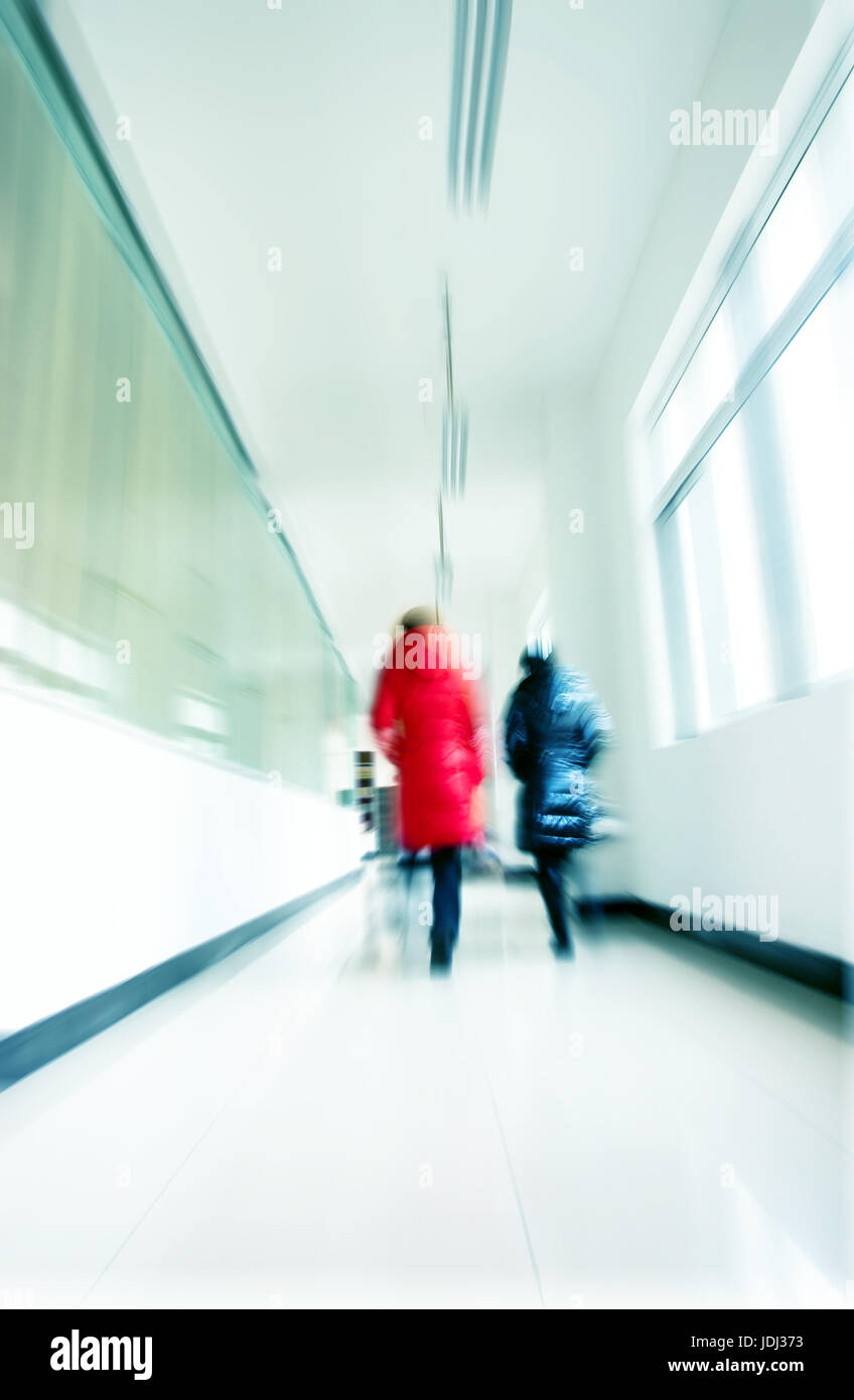 Crowd walking in a corridor Stock Photo - Alamy