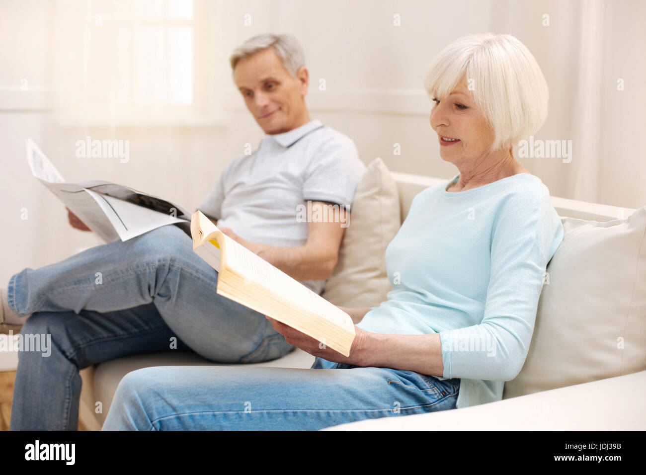 Intelligent relaxed couple enjoying a quiet morning Stock Photo - Alamy