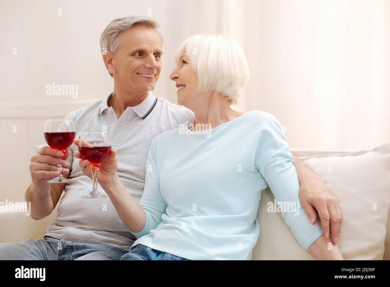 Adorable charming family enjoying their time together Stock Photo - Alamy