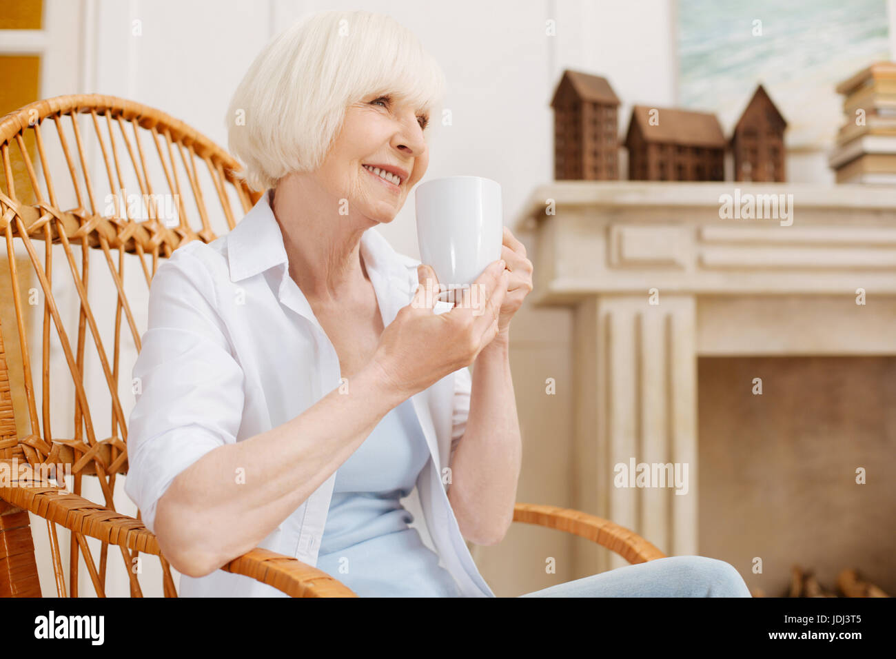 Lively bright lady drinking coffee at home Stock Photo - Alamy