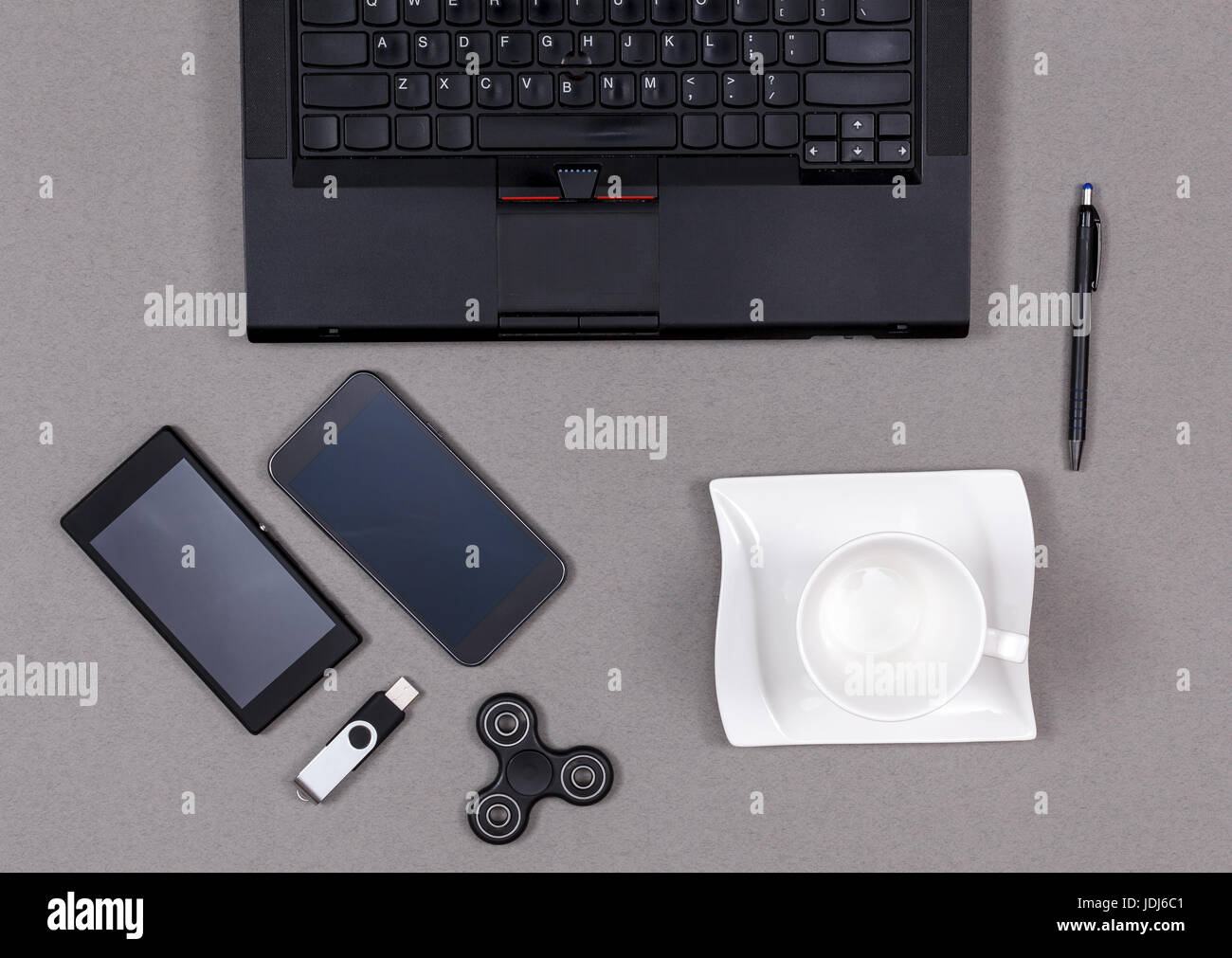 Random office items on table background, notepad, smartphone, pendrive ...