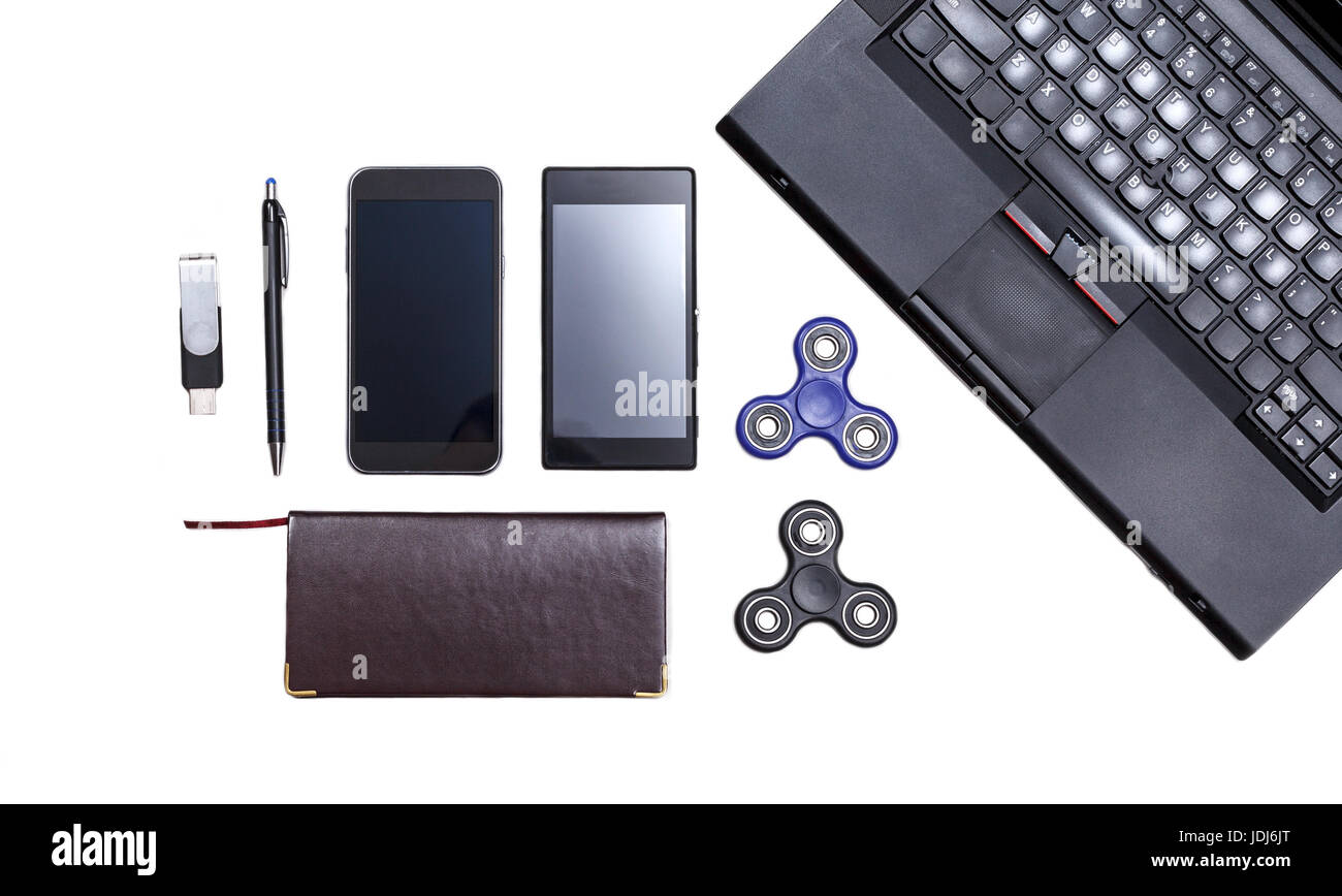 Random office items on table background, notepad, smartphone, pendrive ...