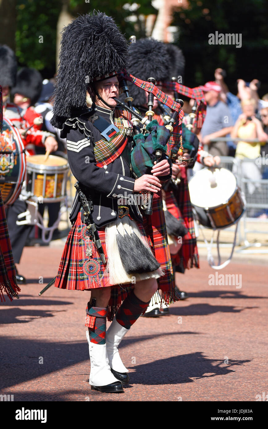 Bagpiper of the Irish Guards band marching during Trooping the Colour ...