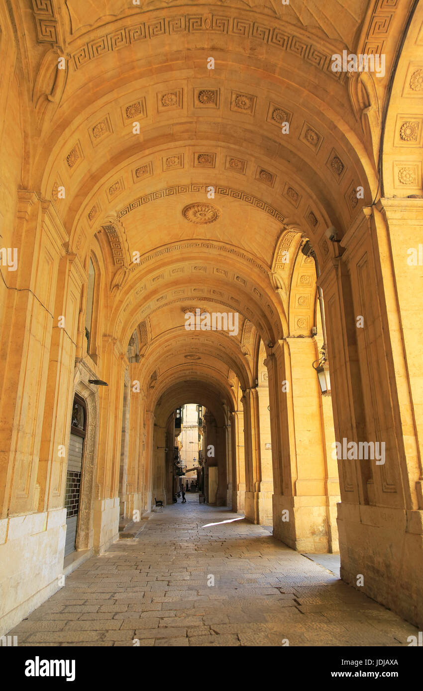 Arched stone passageway gallery National Library building, Valletta ...