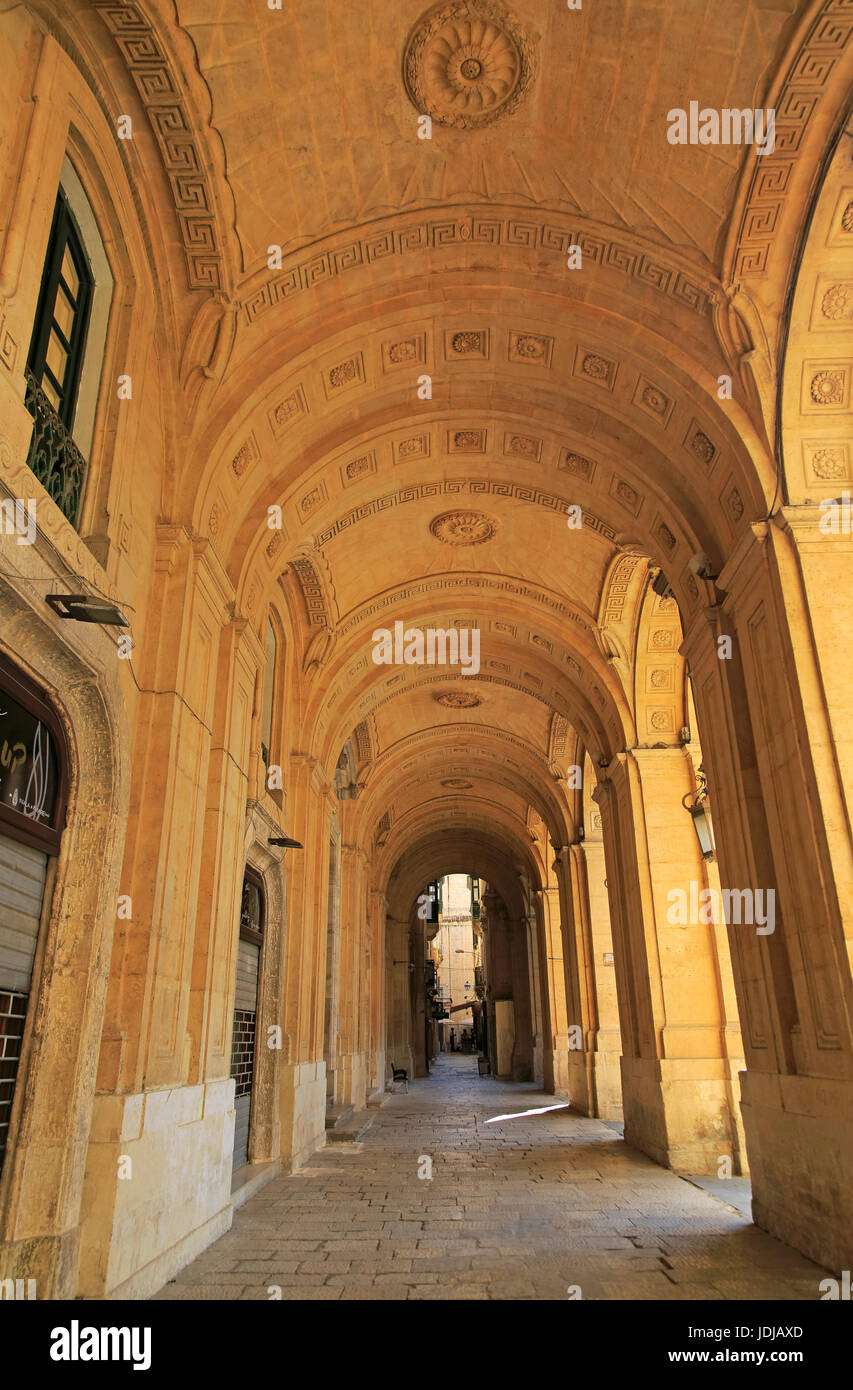 Arched stone passageway gallery National Library building, Valletta ...